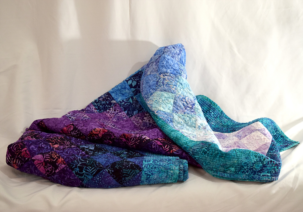 soothing batik half square triangles quilt