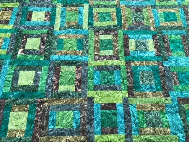 green geometric batik quilts